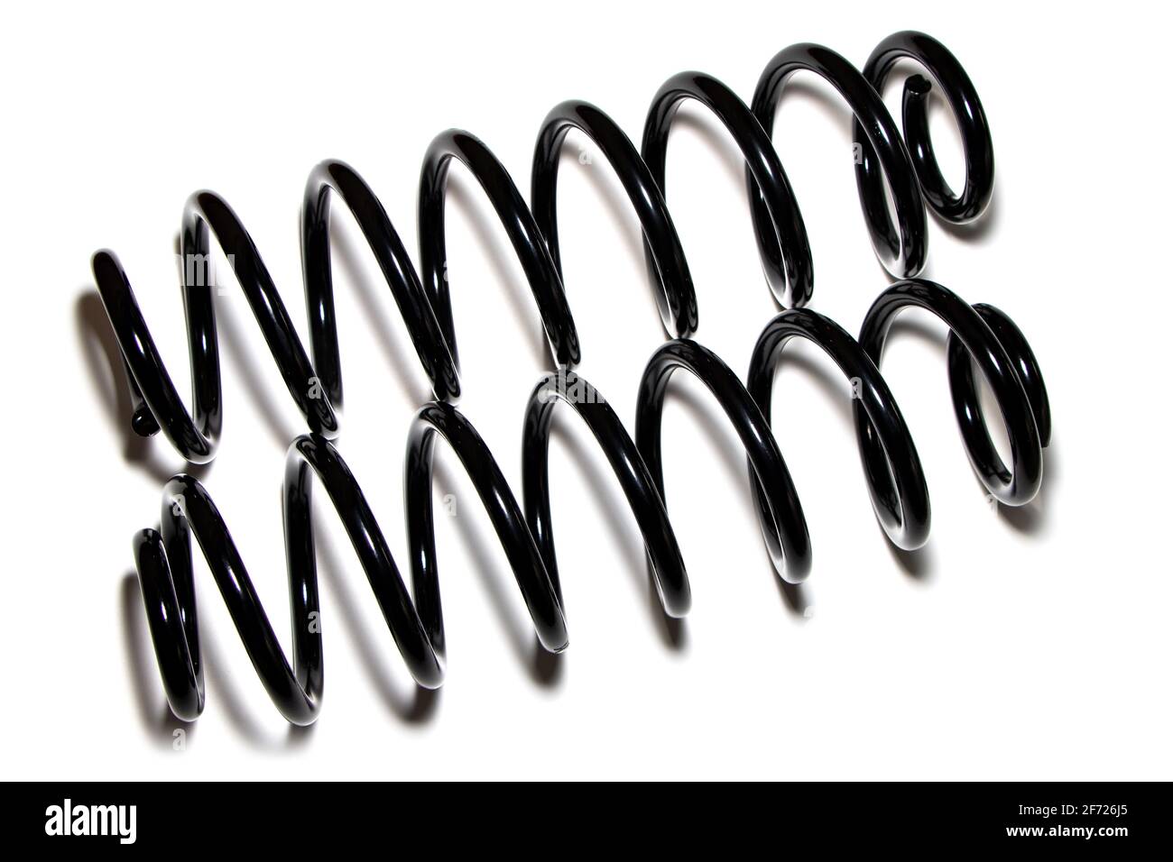 Dark metal spring isolated on white background Stock Photo - Alamy