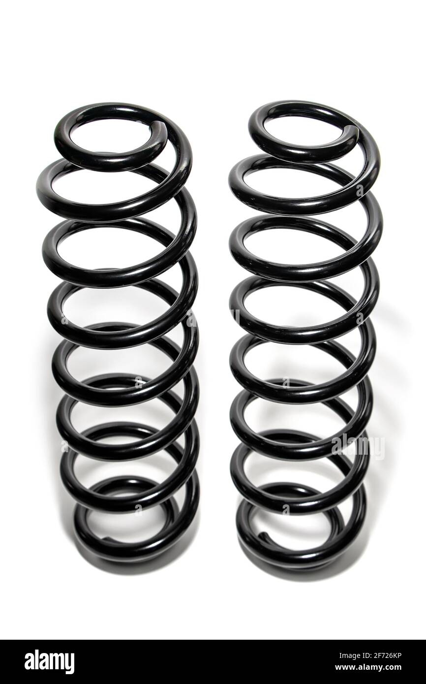 Dark metal spring isolated on white background Stock Photo - Alamy