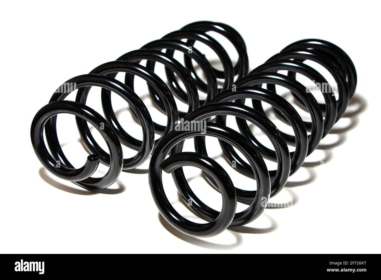 Dark metal spring isolated on white background Stock Photo - Alamy