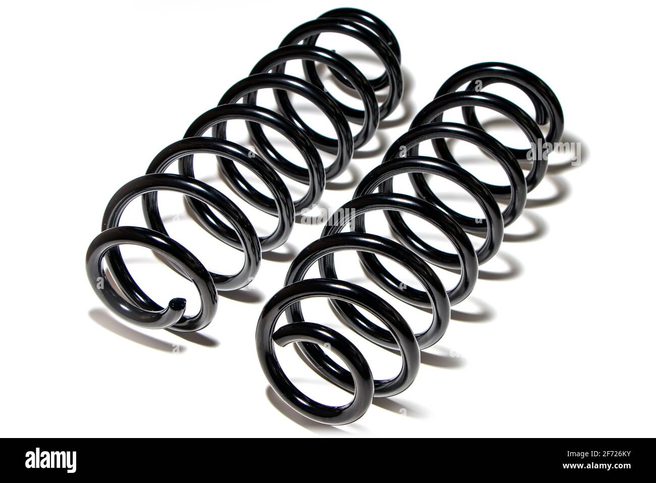 Dark metal spring isolated on white background Stock Photo - Alamy