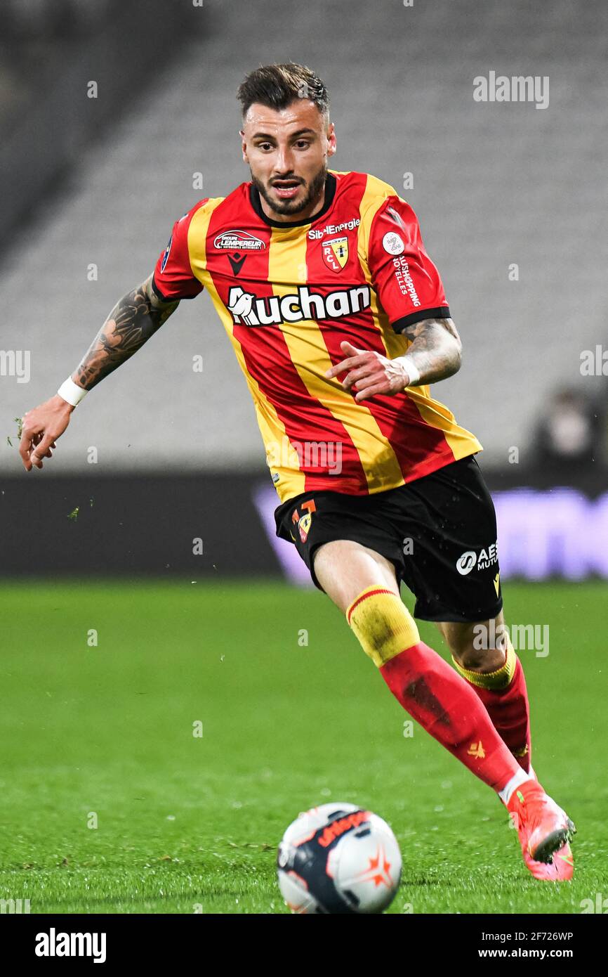 LensâÂ€Â™ French defender Jonathan Clauss runis with the ball during ...