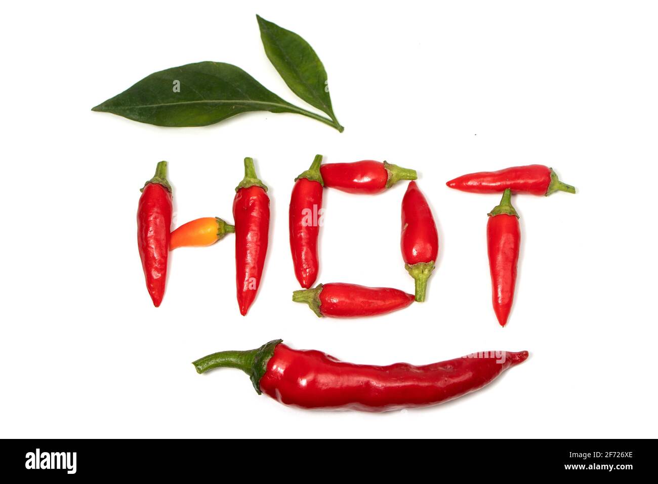 Hot word made from red hot chili pepper on white background Stock Photo ...