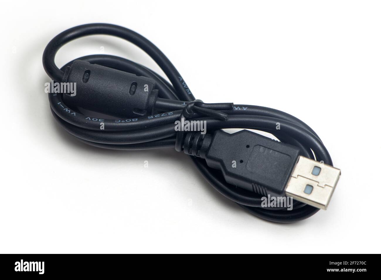 Single black USB-cable. Isolated on white background. Close-up. Studio ...