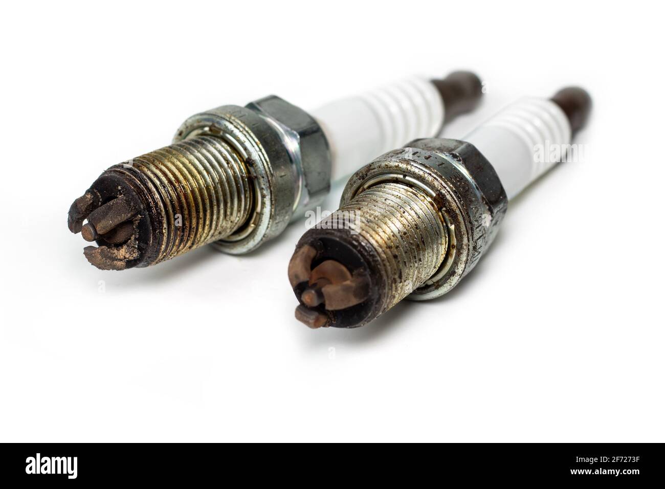 Used old automobile Spark Plug on white background Stock Photo - Alamy