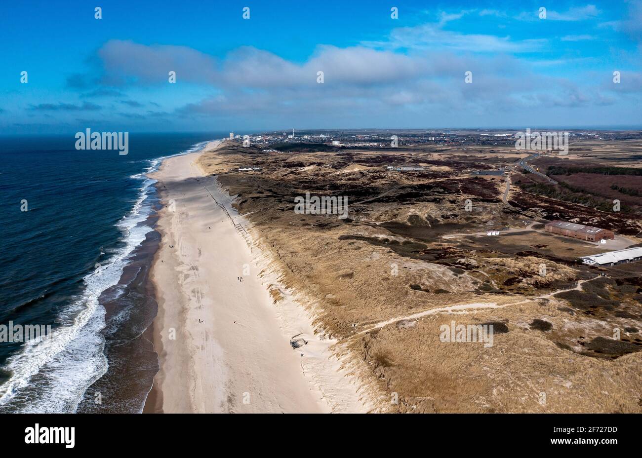 03 April 2021, Schleswig-Holstein, Westerland/Sylt: Some people walk on ...