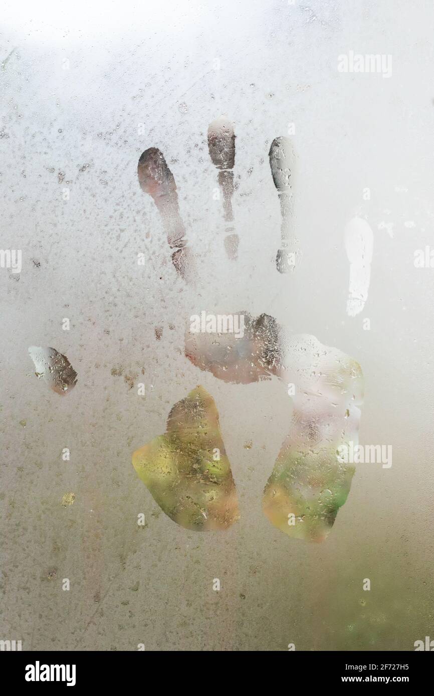 The imprint of the palm of human hand on frozen window glass Stock ...