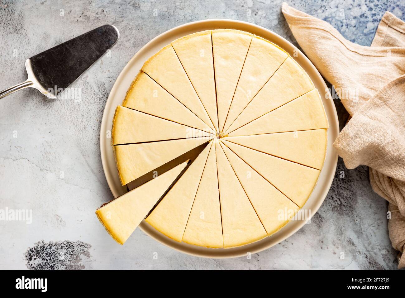 Classic New York cheesecake on light blue concrete background, top view ...