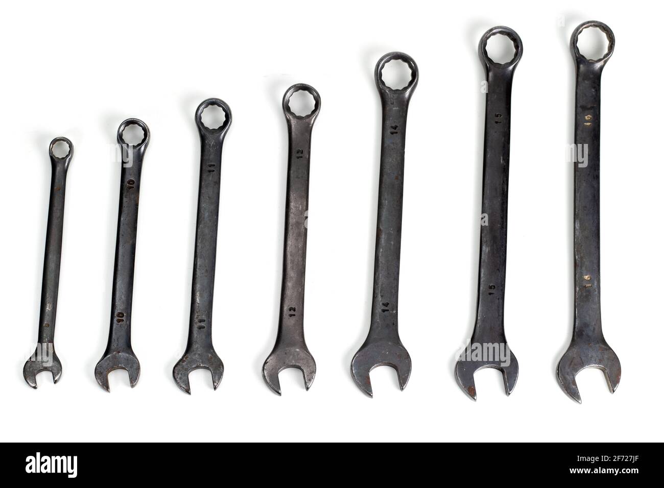 Spanner Set Isolated. dark coloured spanners lying side by side in ...