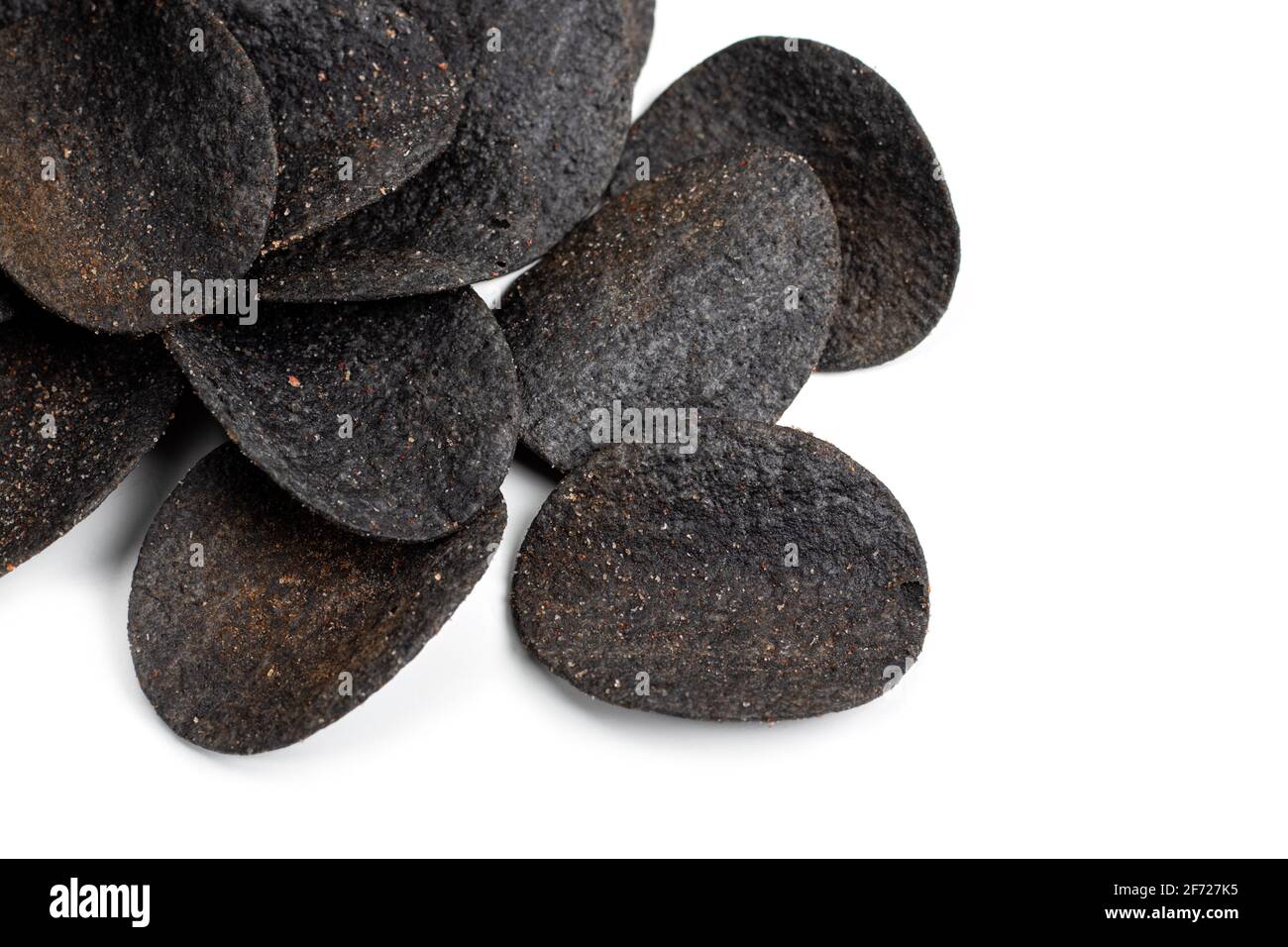 Chips black. Chips with added charcoal and peppers. White background ...