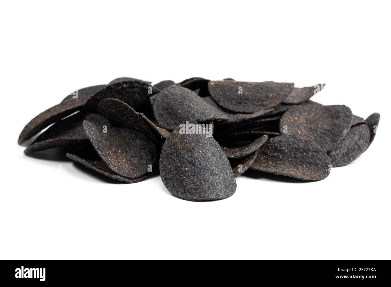 Chips black. Chips with added charcoal and peppers. White background ...