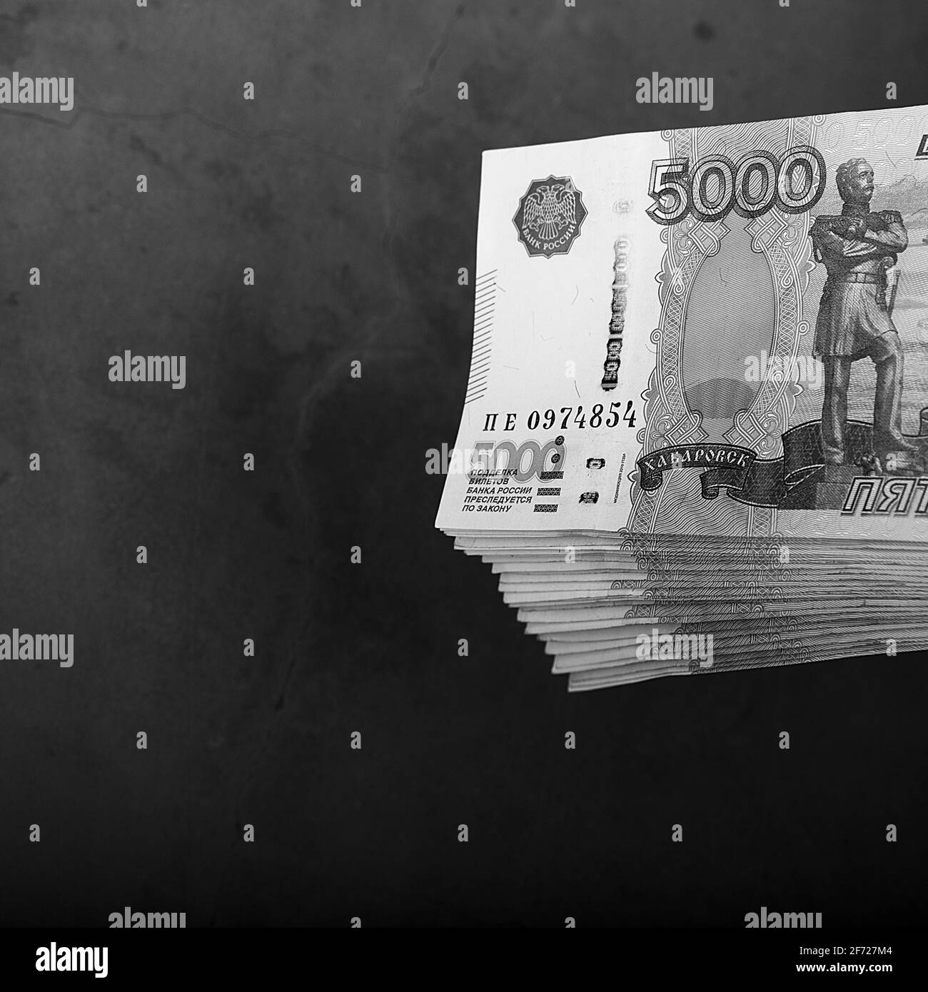 Russian cash banknotes of five thousand rubles, the bundle hangs on a ...