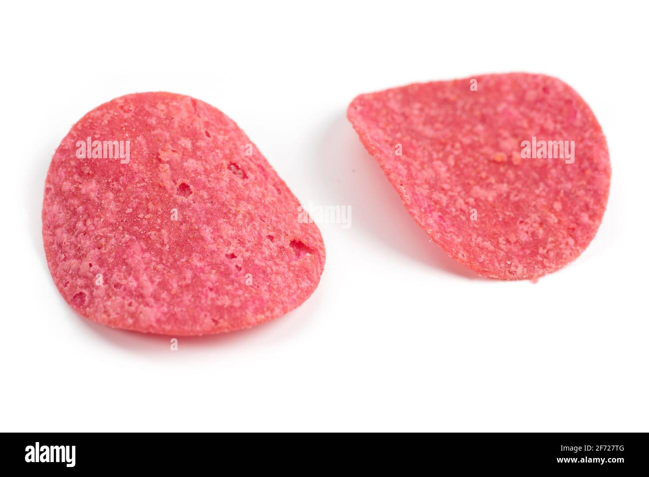 Pink potato chips isolated on white background Stock Photo - Alamy
