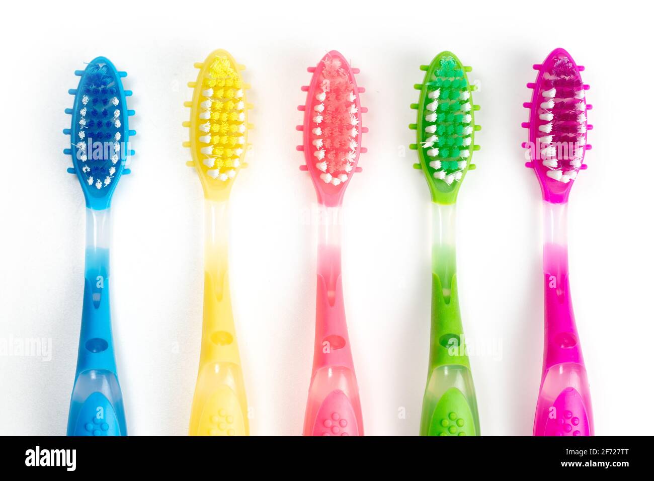 Set colorful toothbrushes on white background Stock Photo - Alamy