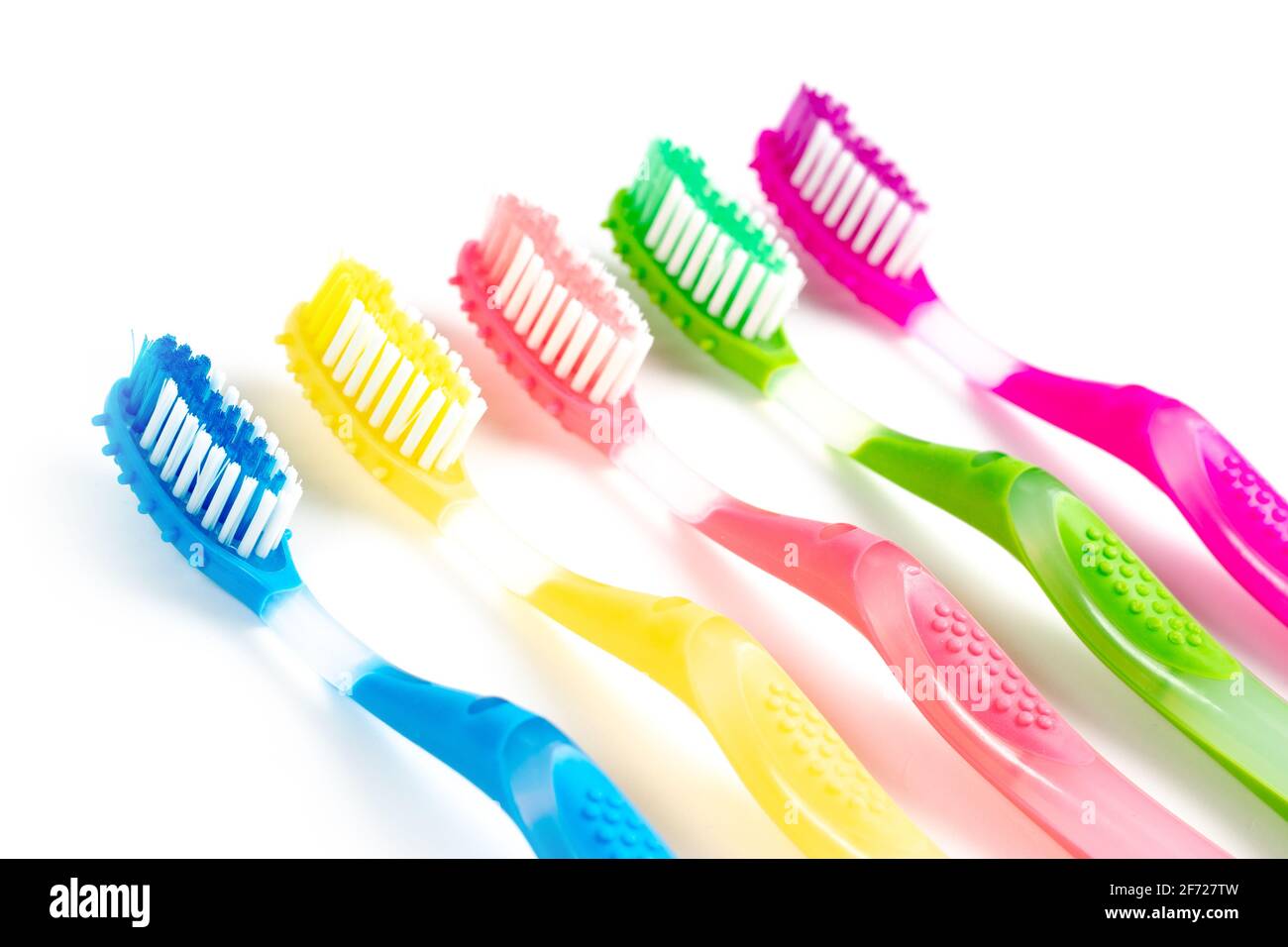 Set colorful toothbrushes on white background Stock Photo - Alamy