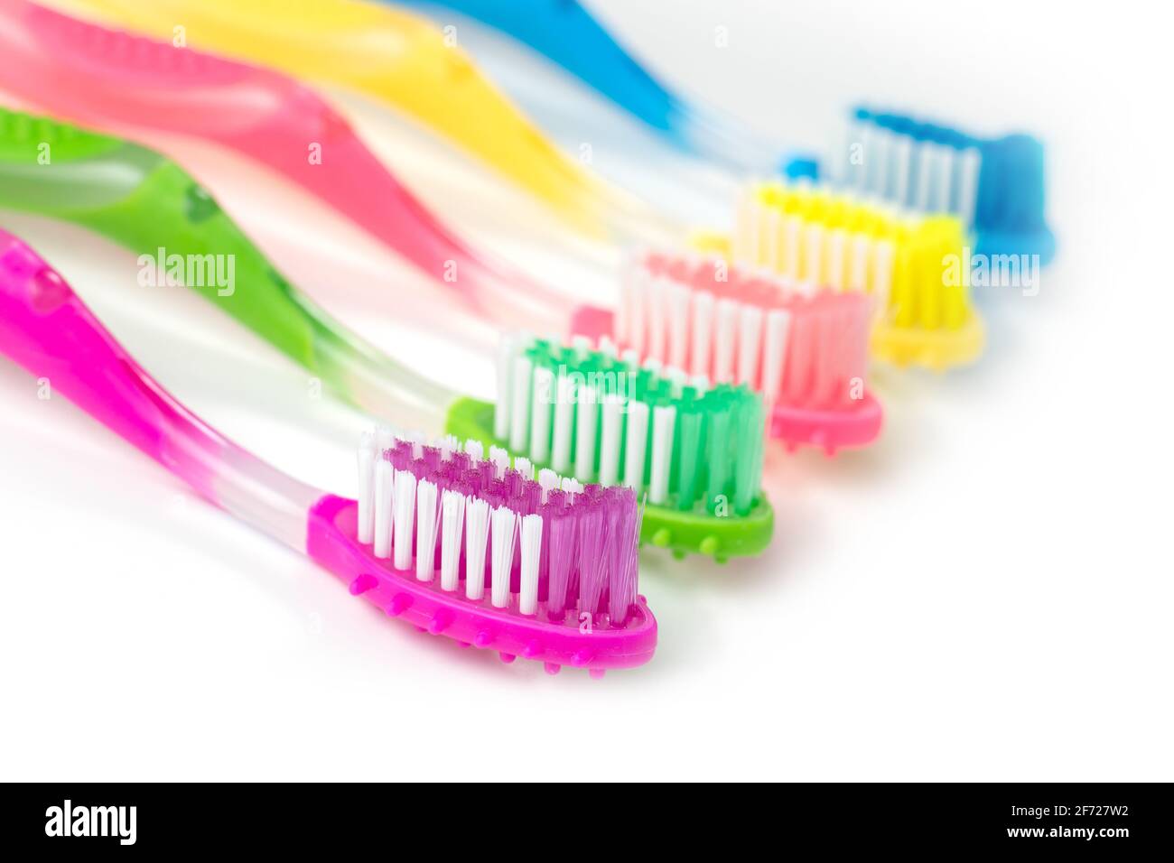 Set colorful toothbrushes on white background Stock Photo - Alamy