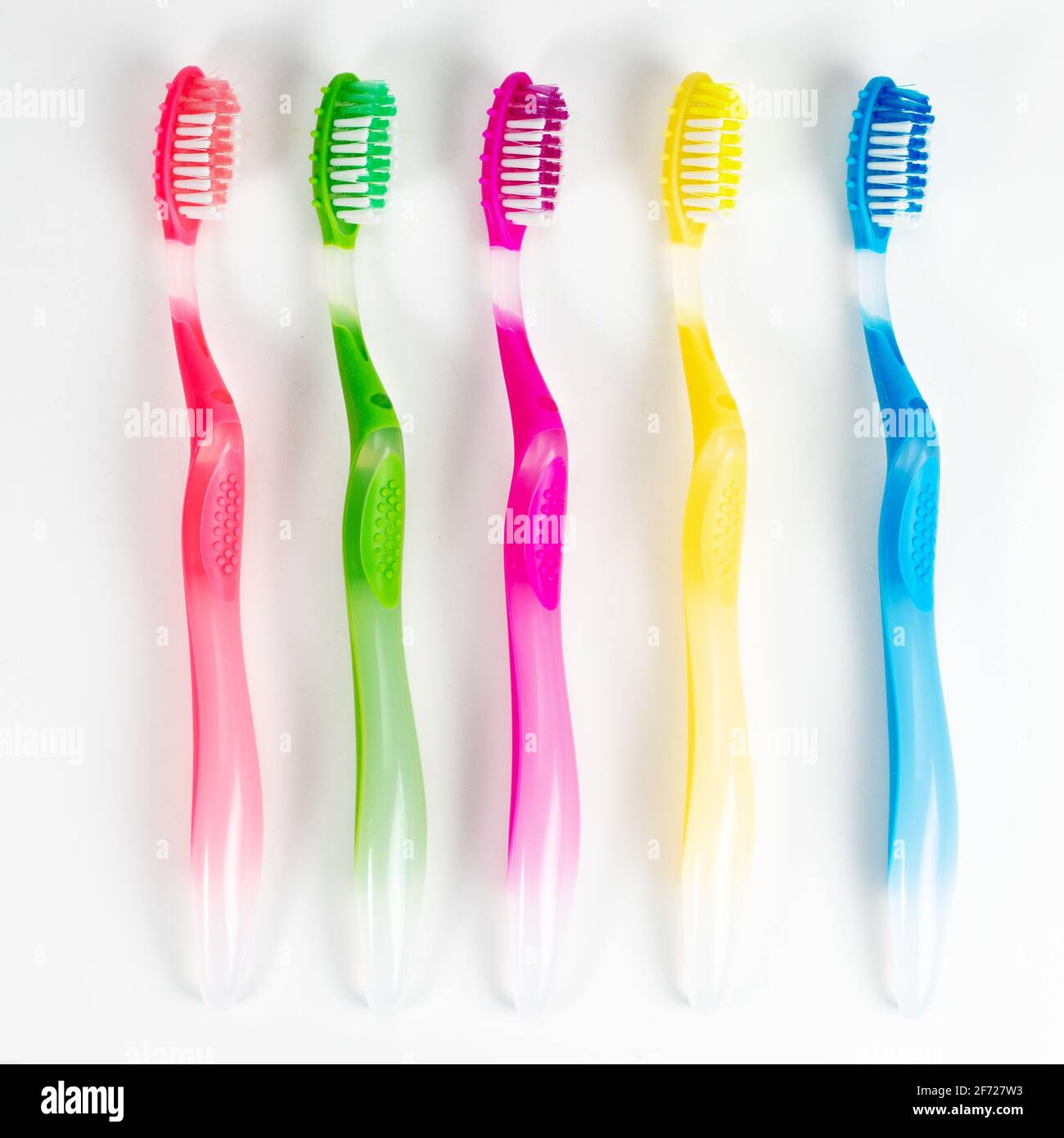 Set colorful toothbrushes on white background Stock Photo - Alamy