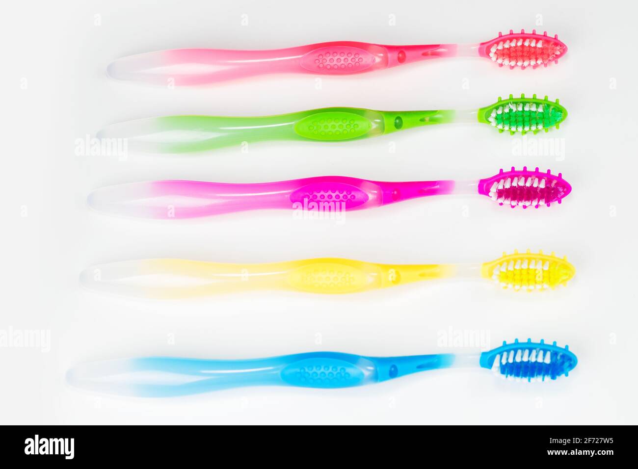 Set colorful toothbrushes on white background Stock Photo - Alamy