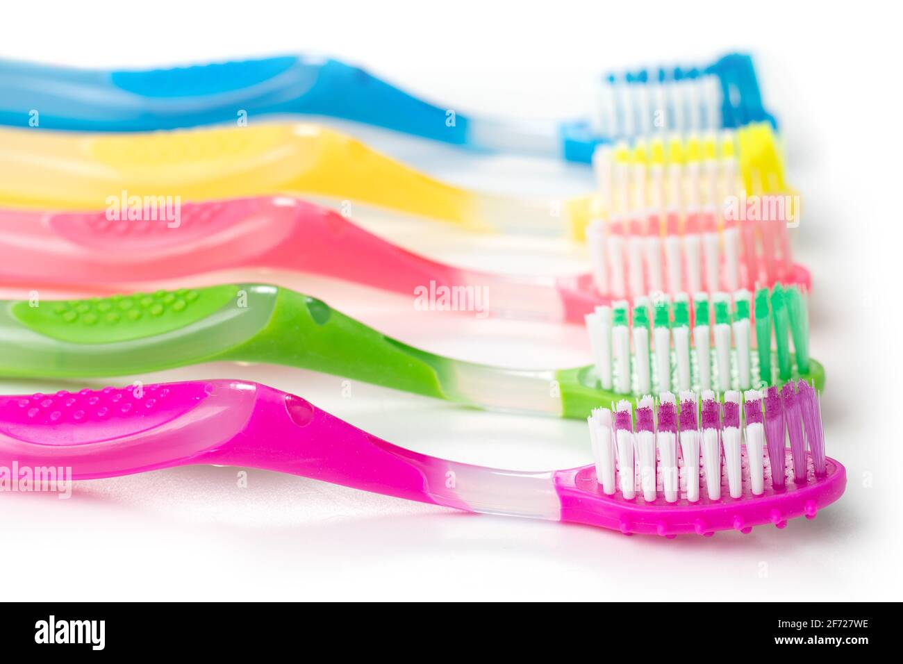 Set colorful toothbrushes on white background Stock Photo - Alamy