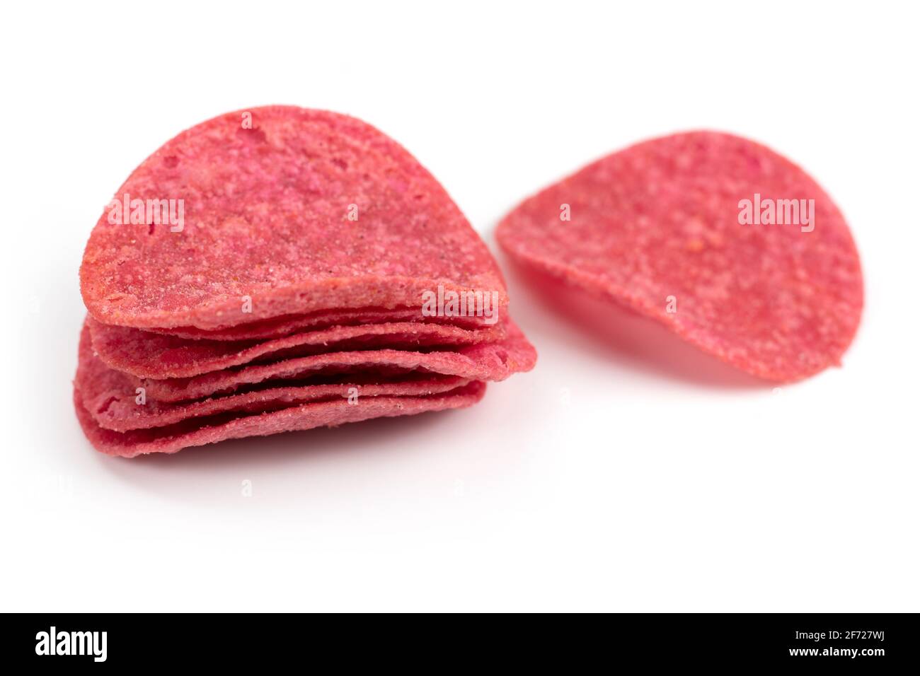 Pink potato chips isolated on white background Stock Photo - Alamy