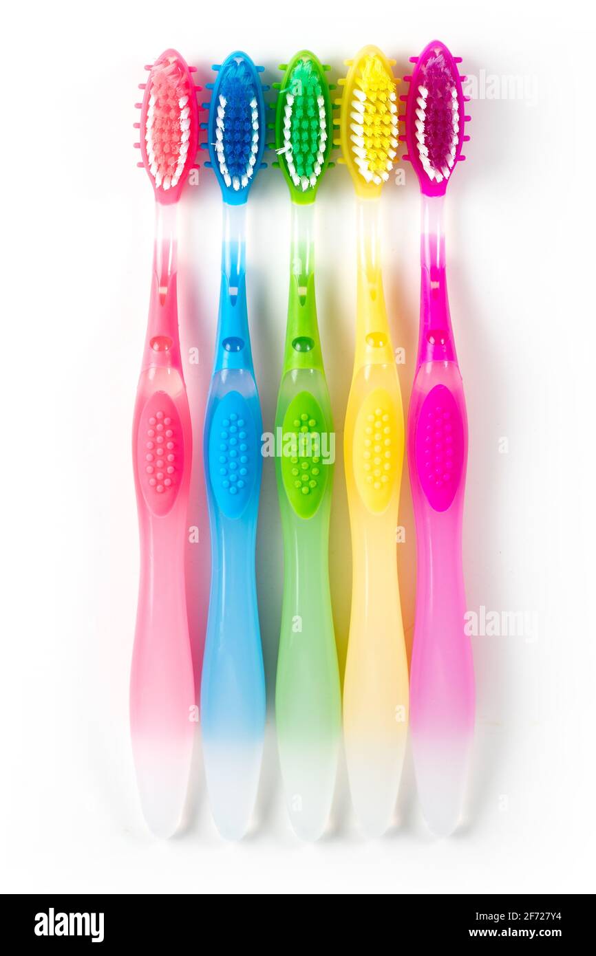 Set colorful toothbrushes on white background Stock Photo - Alamy