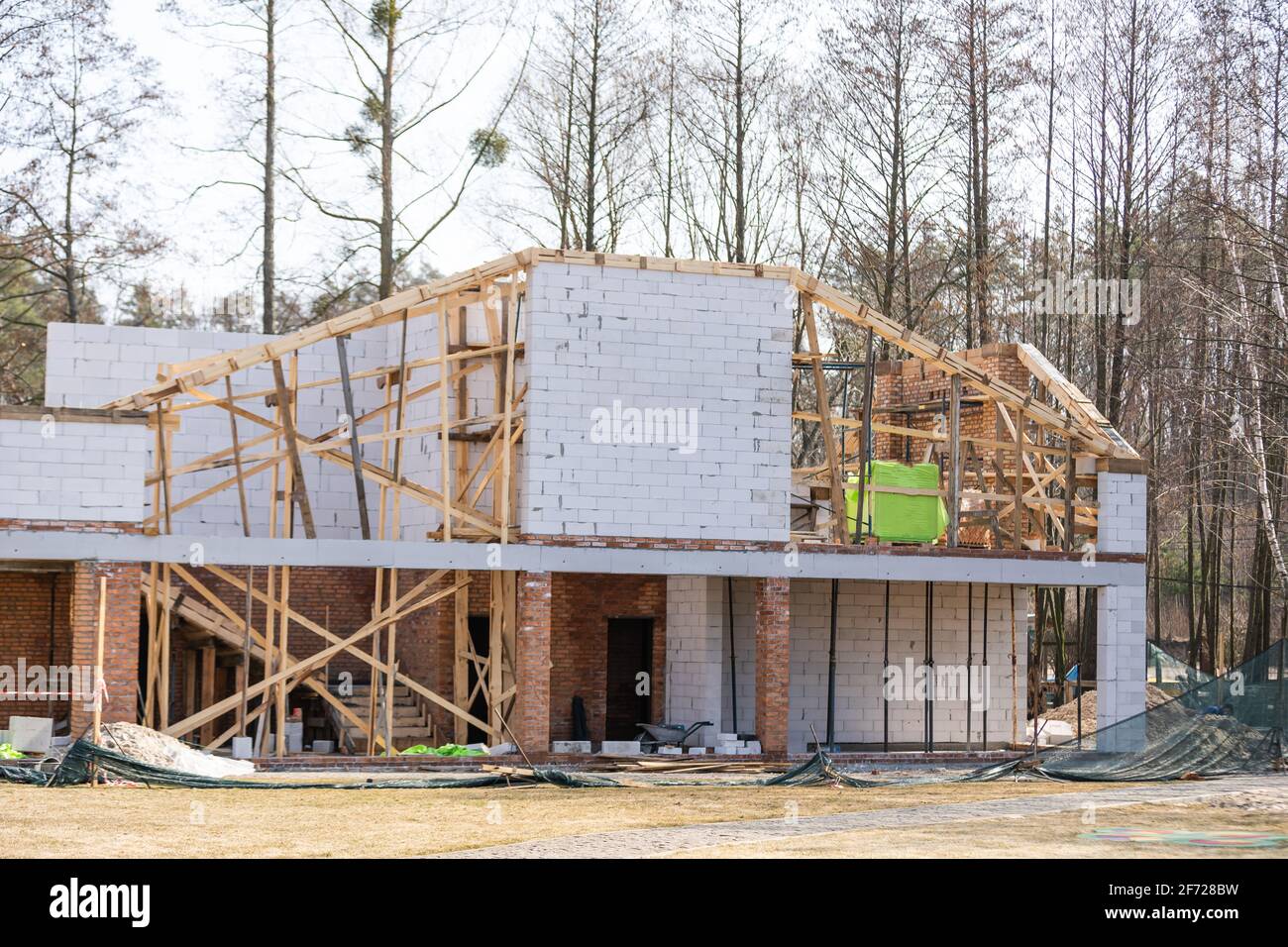 Facade of building made from white blocks with big windows under ...