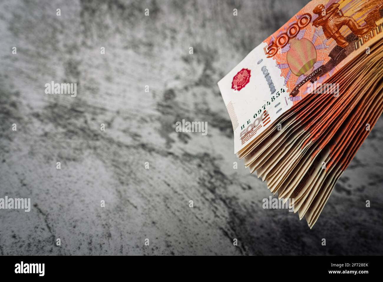 Russian rubles a large bundle on a gray background. A bundle of five ...