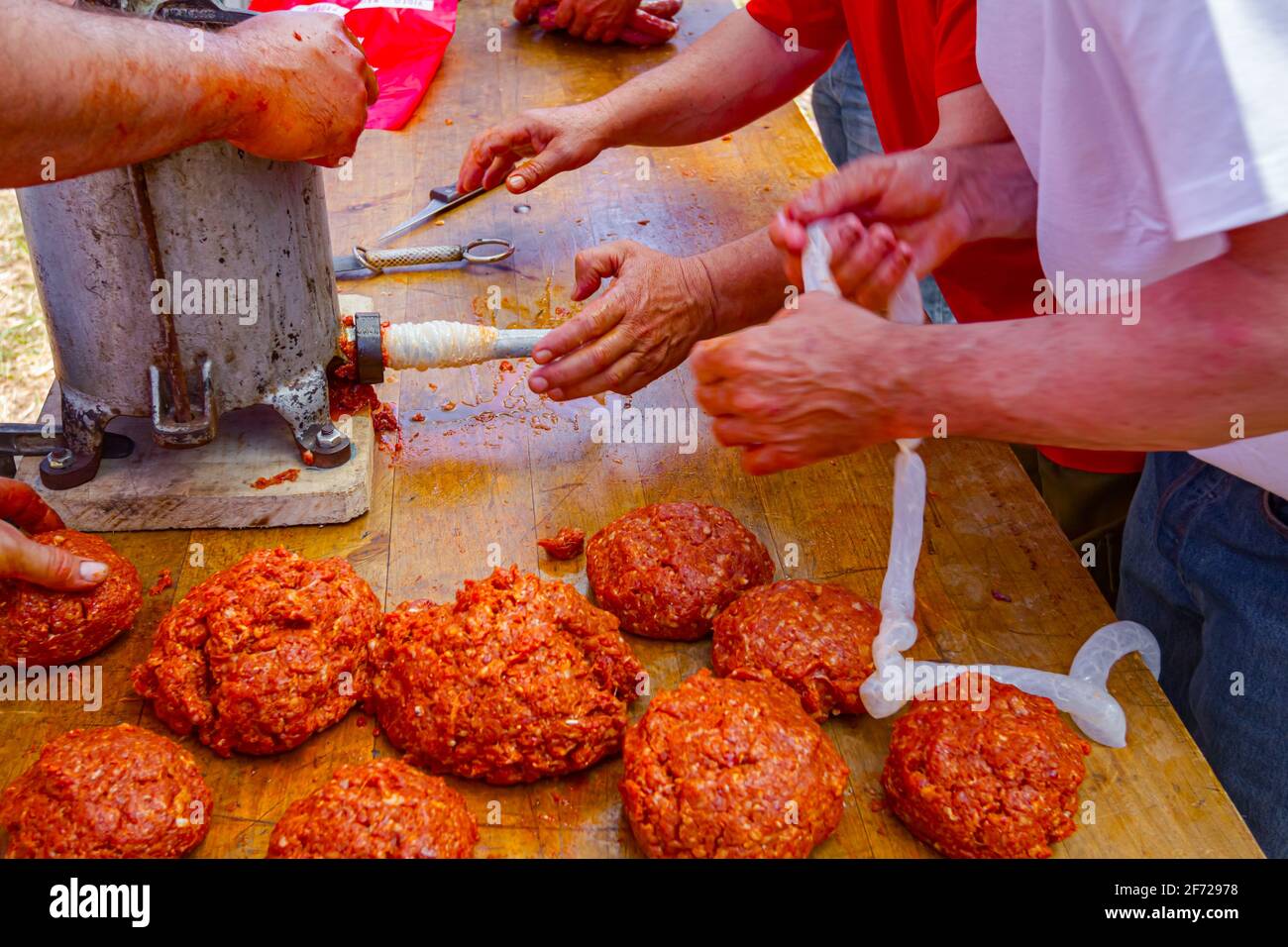 Fill up pig intestines to make sausage with machine for handmade ...
