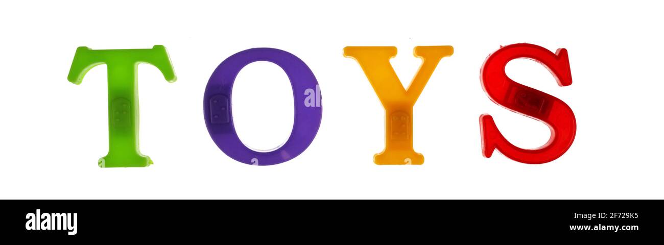 Toys word lined with plastic multicolored letters on white background ...