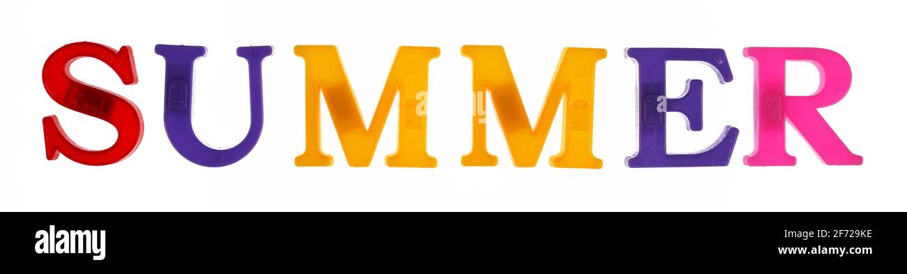 Summer word lined with plastic multicolored letters on white background ...