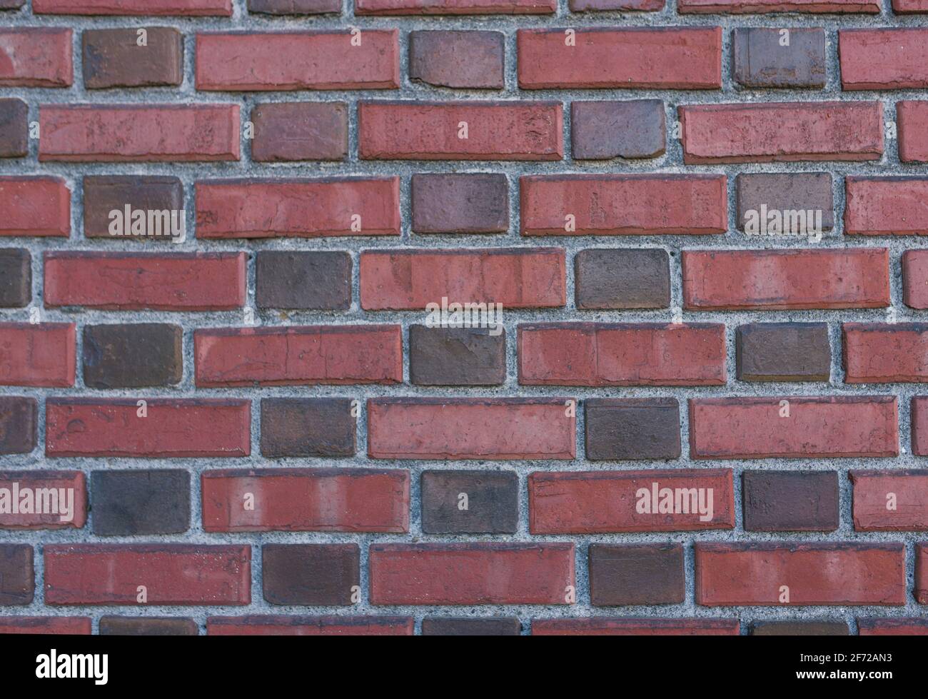 Brick wall made of red and burgundy bricks. Copying a space Stock Photo ...
