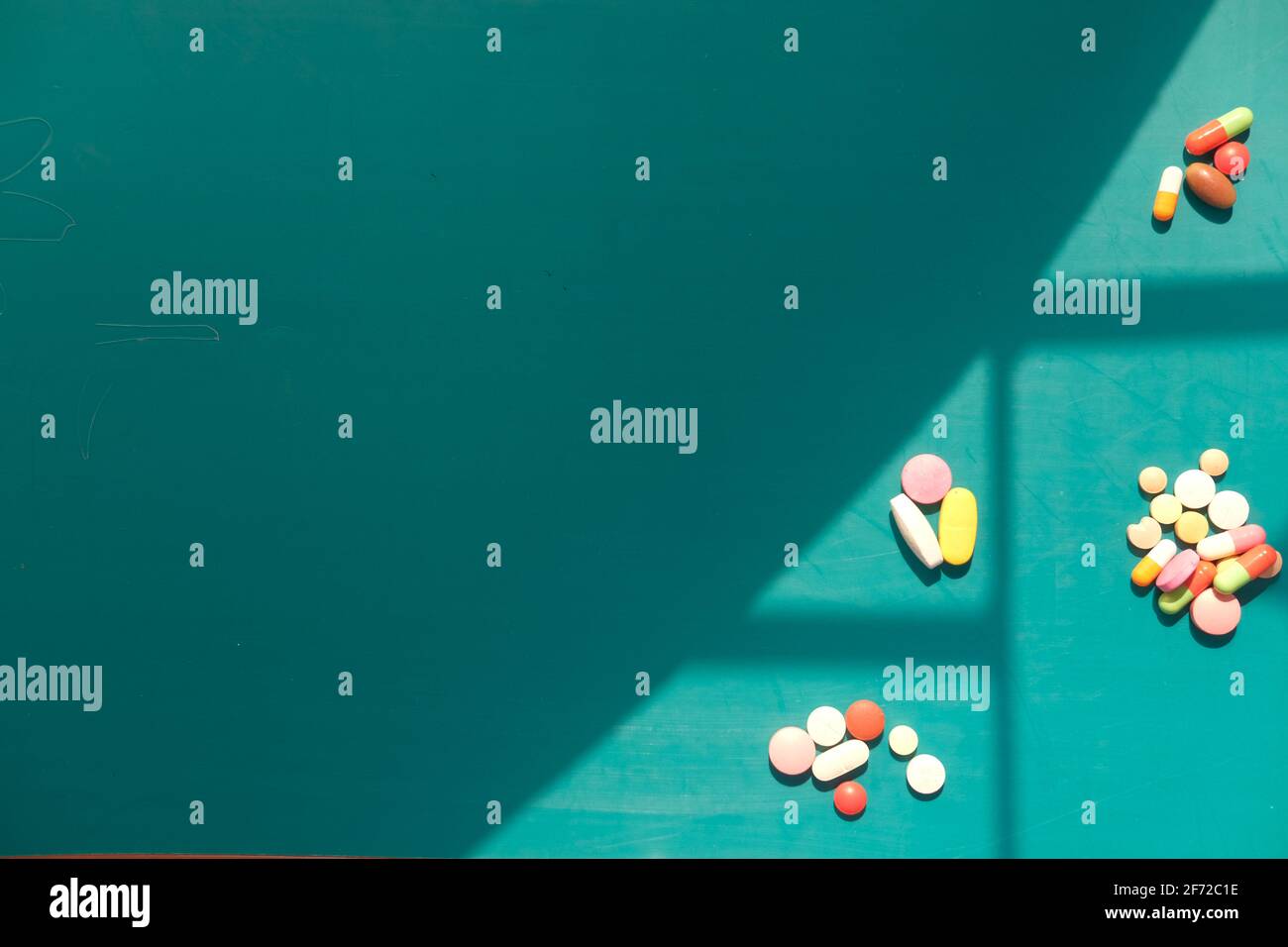 top view of many colorful pills and capsules on green background Stock ...
