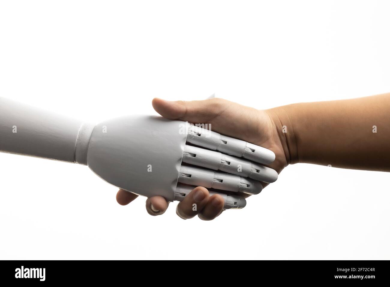 White robot hand shake with human isolated on white background Stock ...