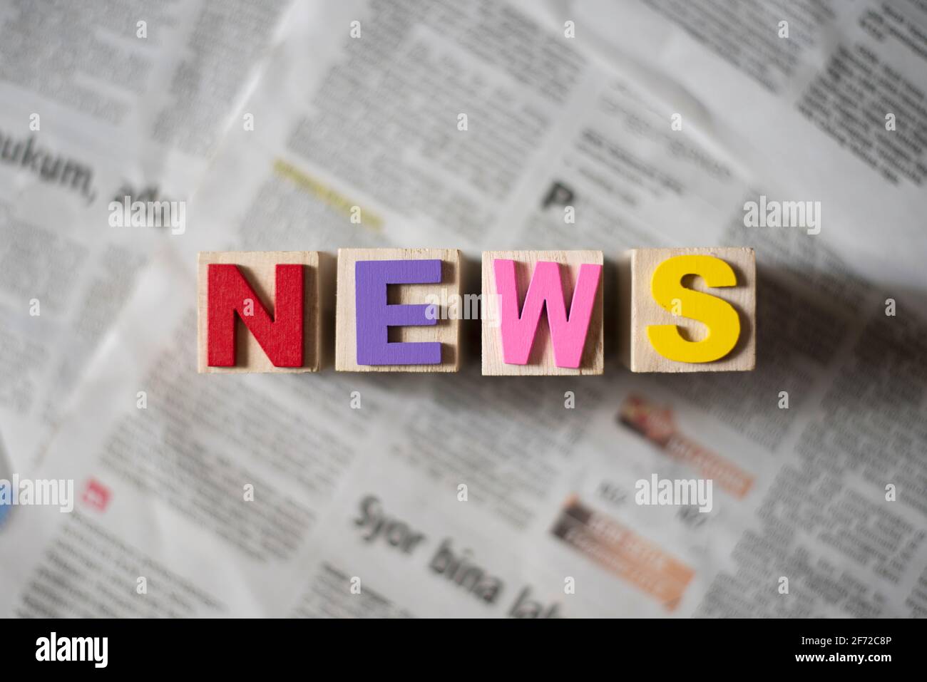 word news on a newspaper background. Concept of journalism and current ...