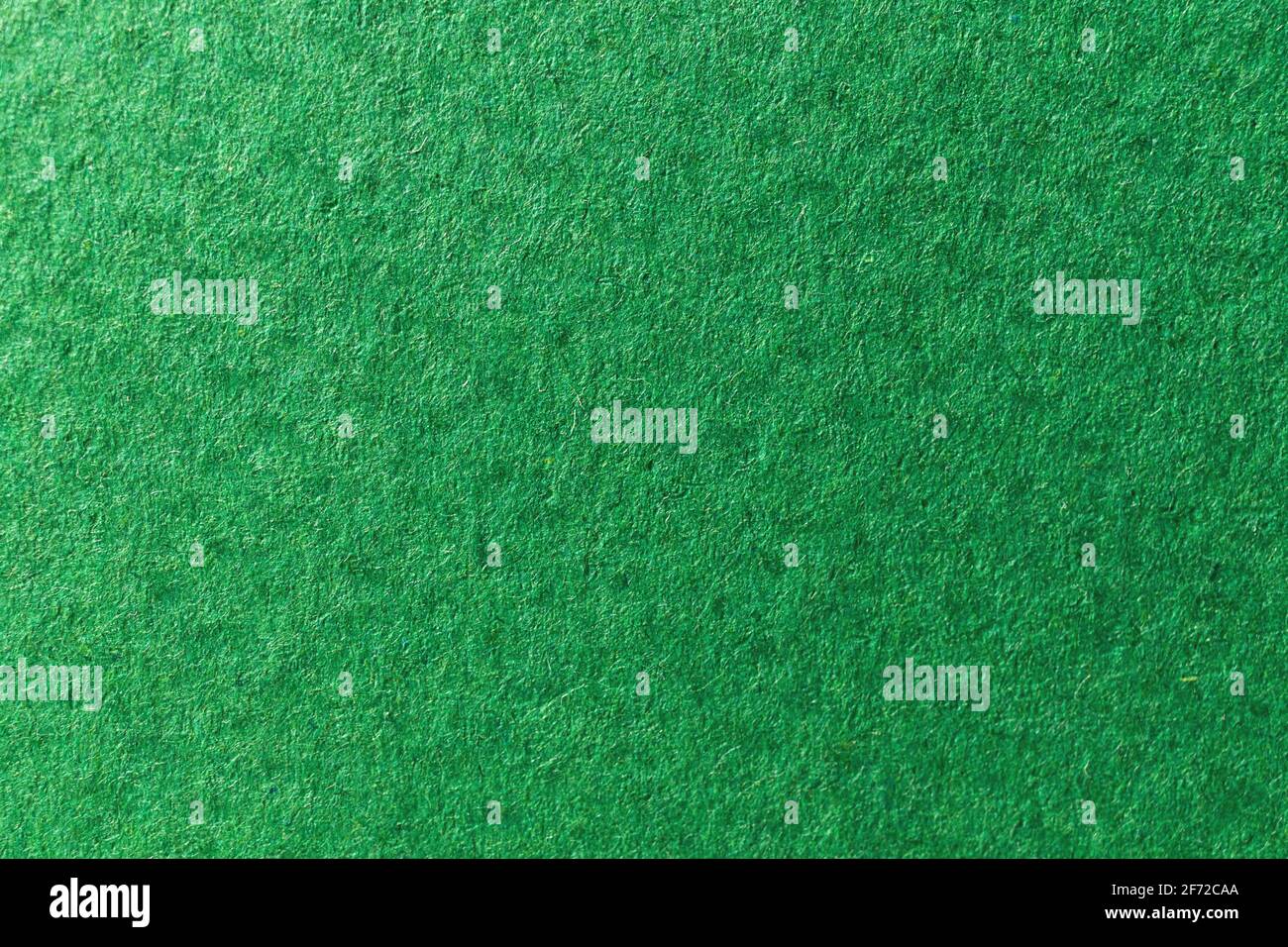 Green detailed and grainy paper texture, paper surface close up ...
