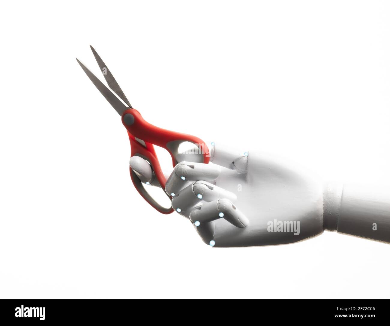Robot hand hold pair of scissors isolated on white Stock Photo - Alamy