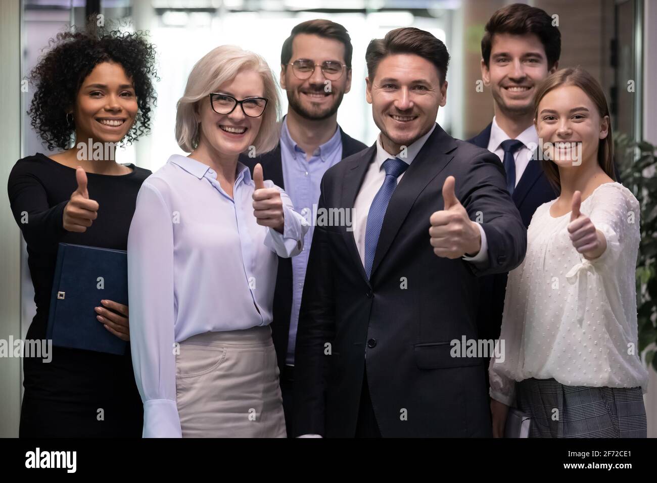 Together show thumbs up hi-res stock photography and images - Alamy