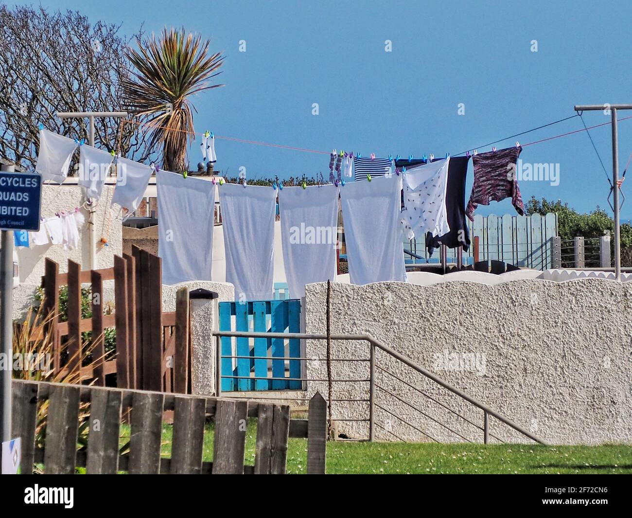 Hang out the washing on a washing line Stock Photo - Alamy