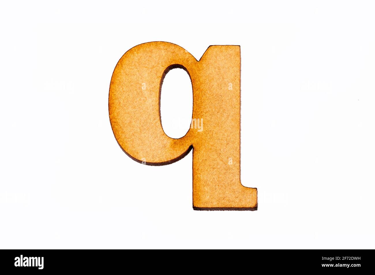 Lowercase letter q - Piece in wood Stock Photo - Alamy