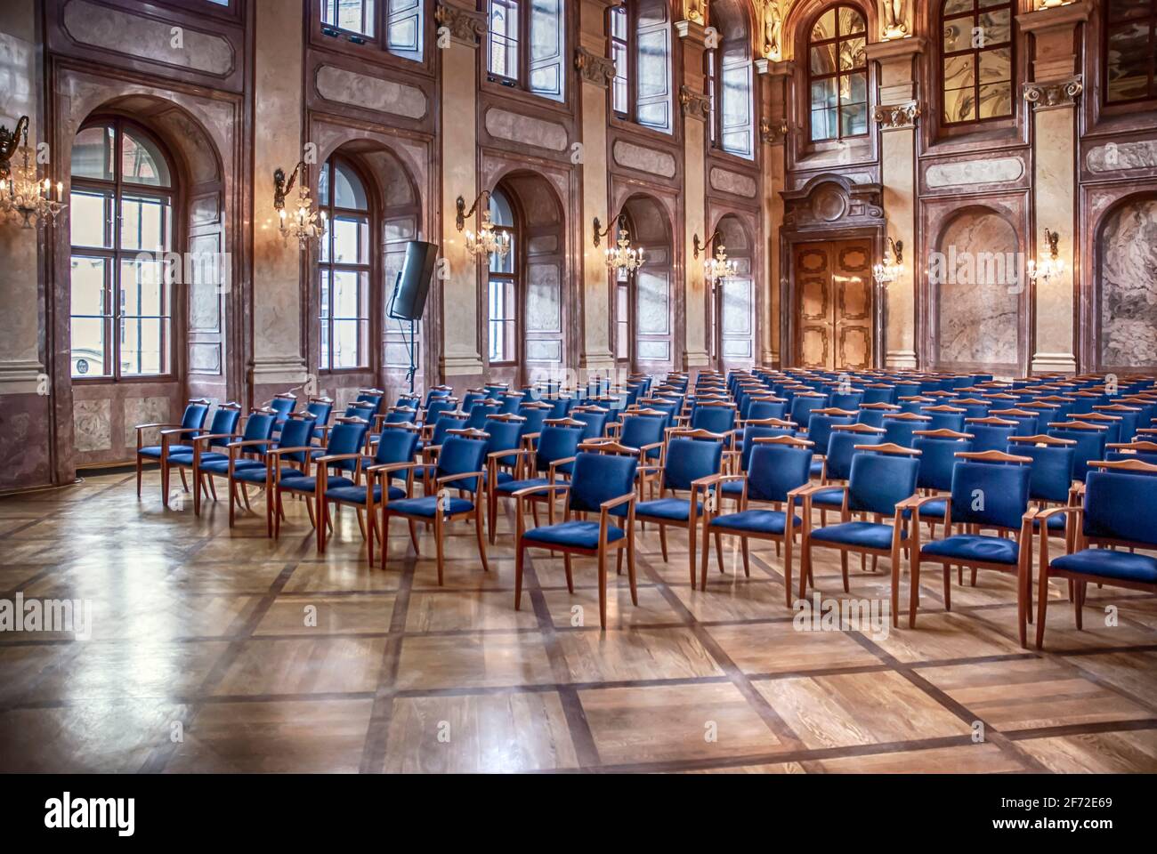 Empty hall with rows of chairs Stock Photo - Alamy