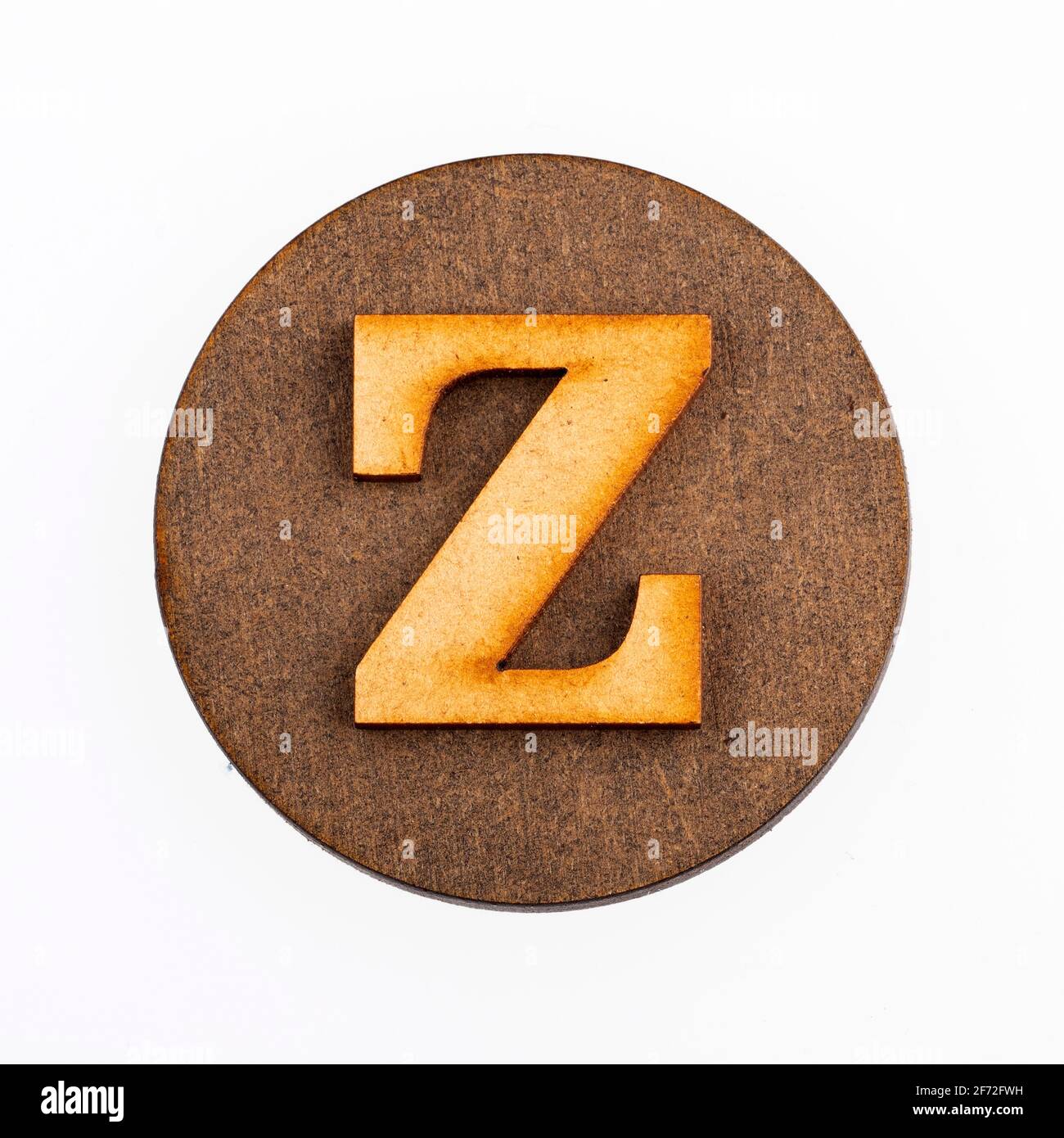 Letter Z on a wood circle - Alphabet Stock Photo - Alamy