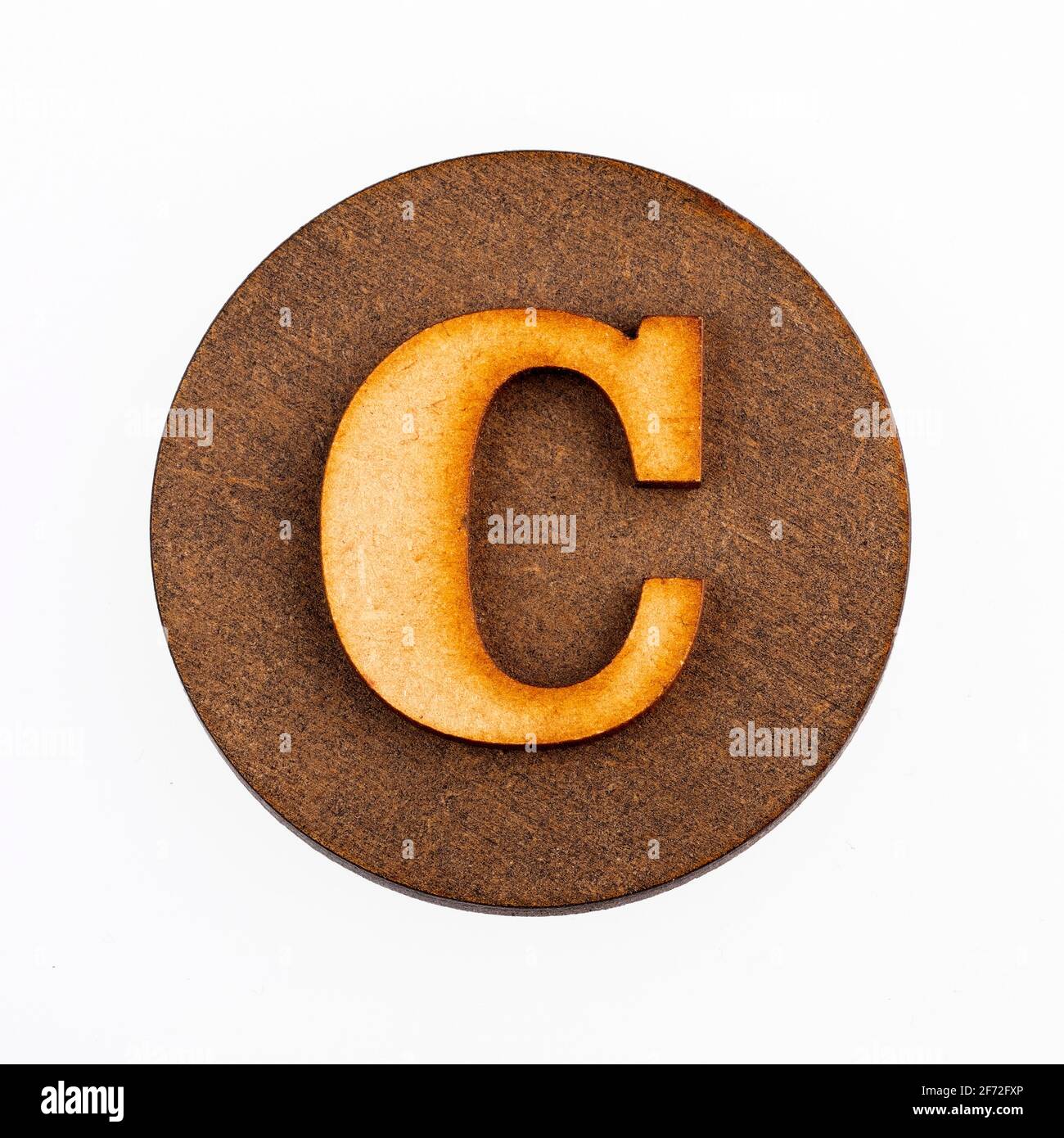 Letter C on a wood circle - Alphabet Stock Photo - Alamy