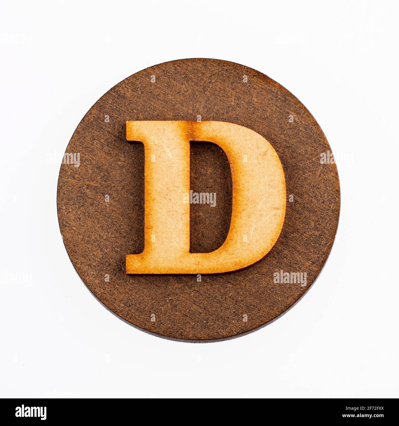 Letter D on a wood circle - Alphabet Stock Photo - Alamy