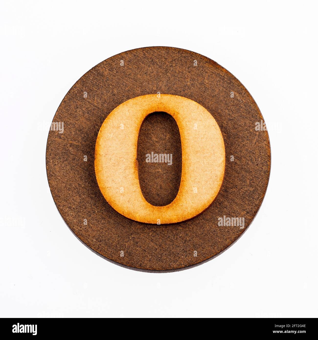 Letter O on a wood circle - Alphabet Stock Photo - Alamy