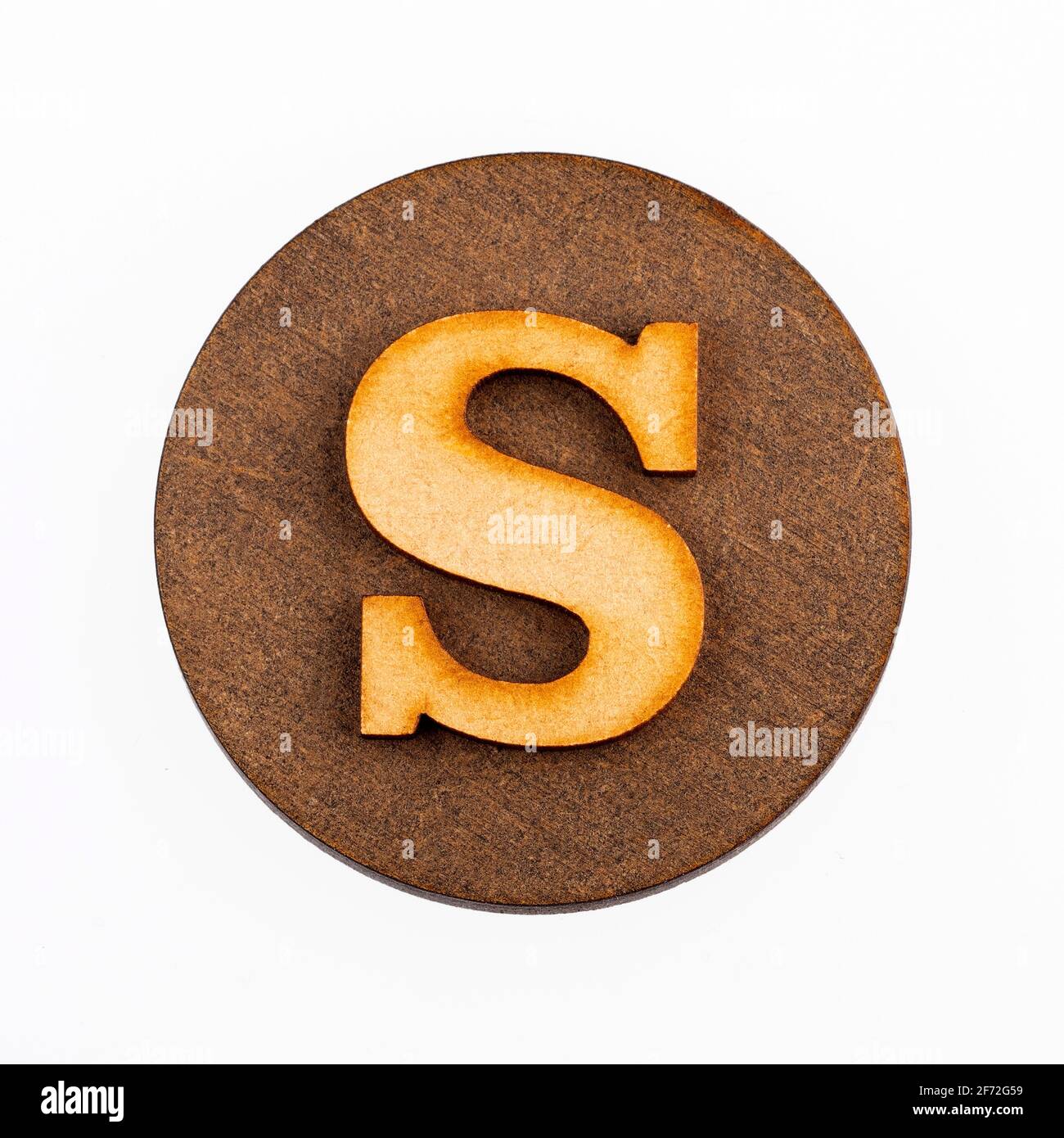 Letter S on a wood circle - Alphabet Stock Photo - Alamy