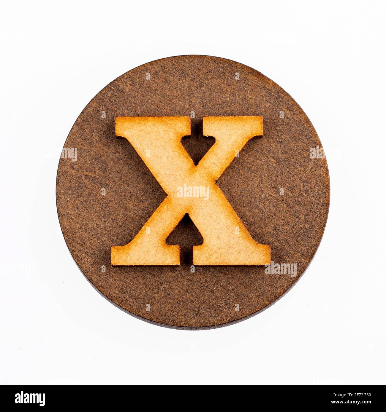 Letter X on a wood circle - Alphabet Stock Photo - Alamy