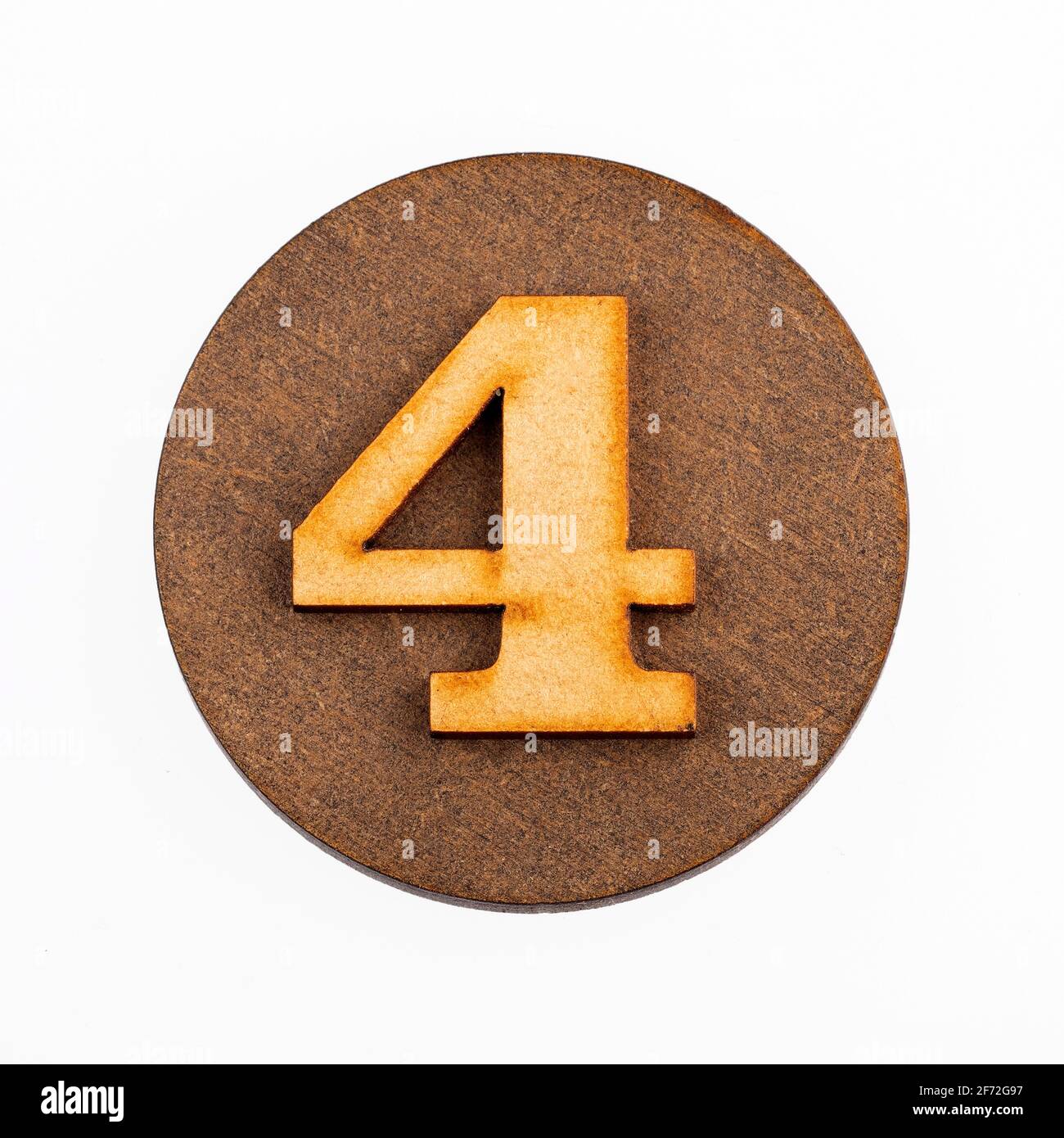 Number 4 in a wooden circle Stock Photo - Alamy