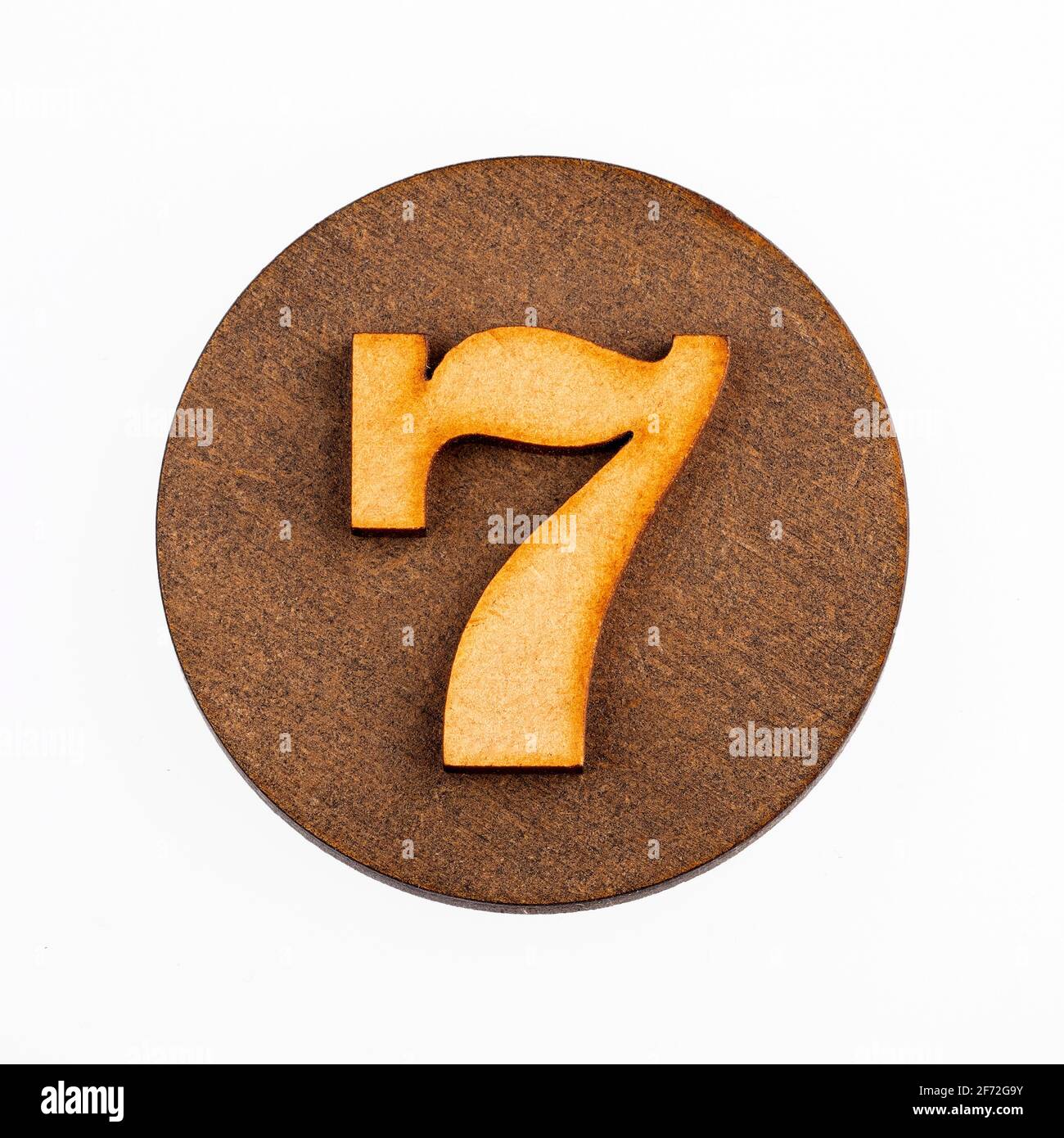 Number 7 in a wooden circle Stock Photo - Alamy