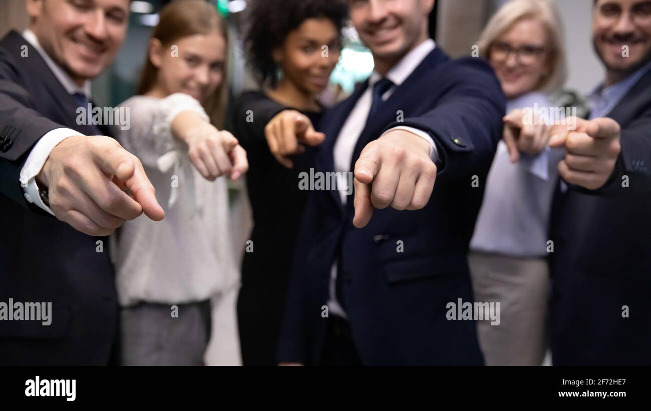 Close up of motivated diverse employees point at screen Stock Photo - Alamy