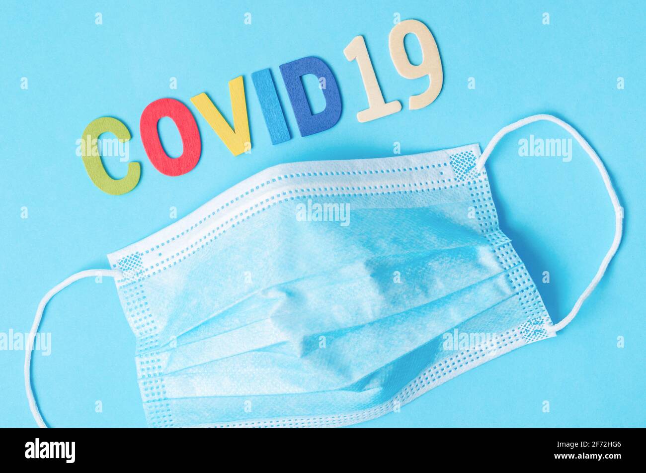 Disposable face mask with letters and text corona virus, top view ...