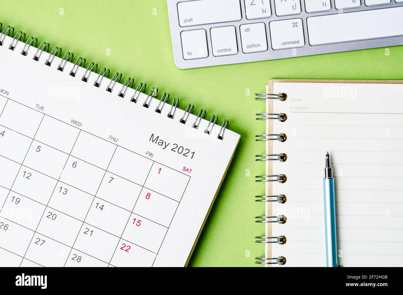 May 2021 calendar with note book on green color background Stock Photo ...
